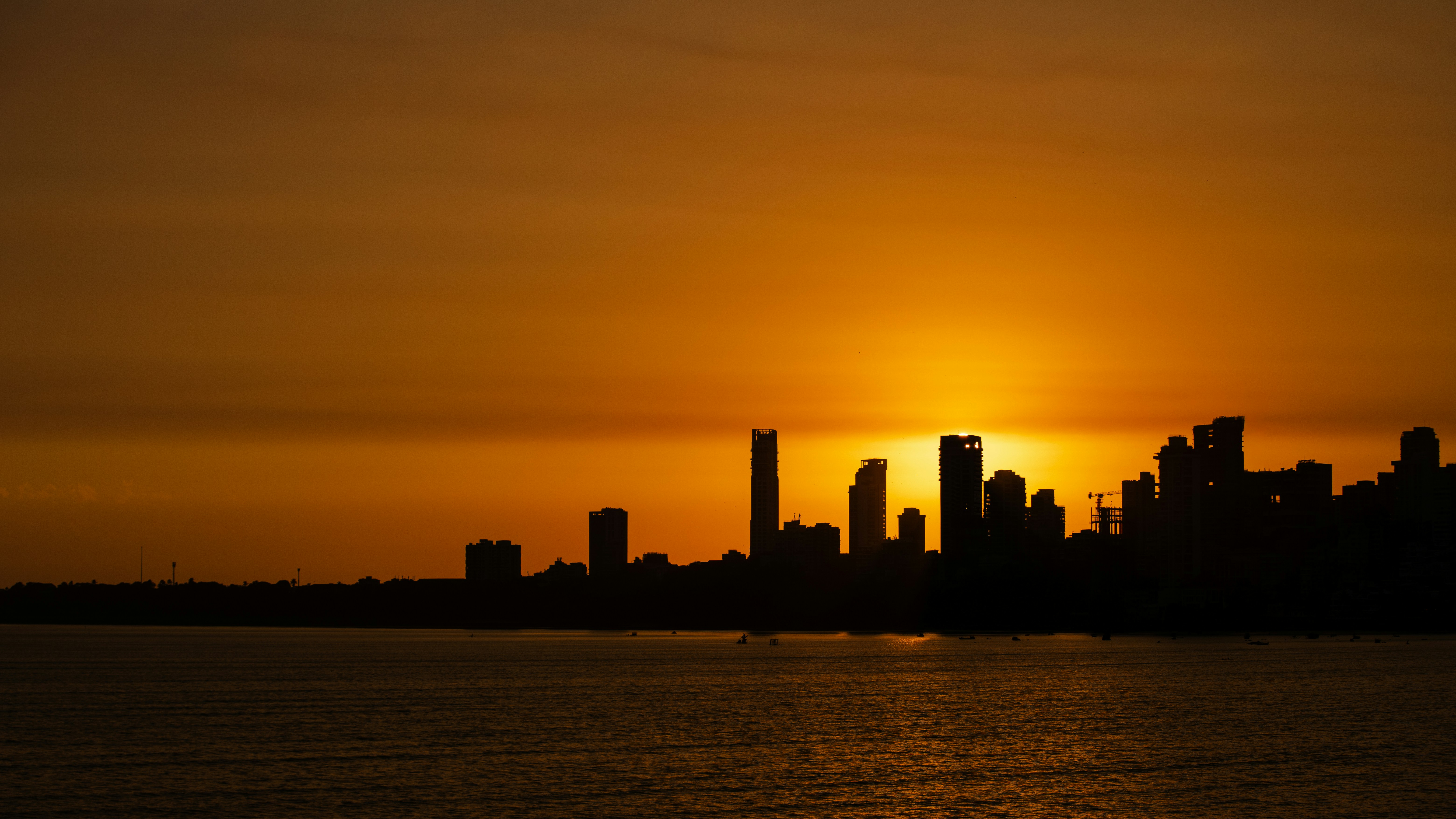 Sunset Pulse Over the Silhouette: City Skyline in Quiet Glow