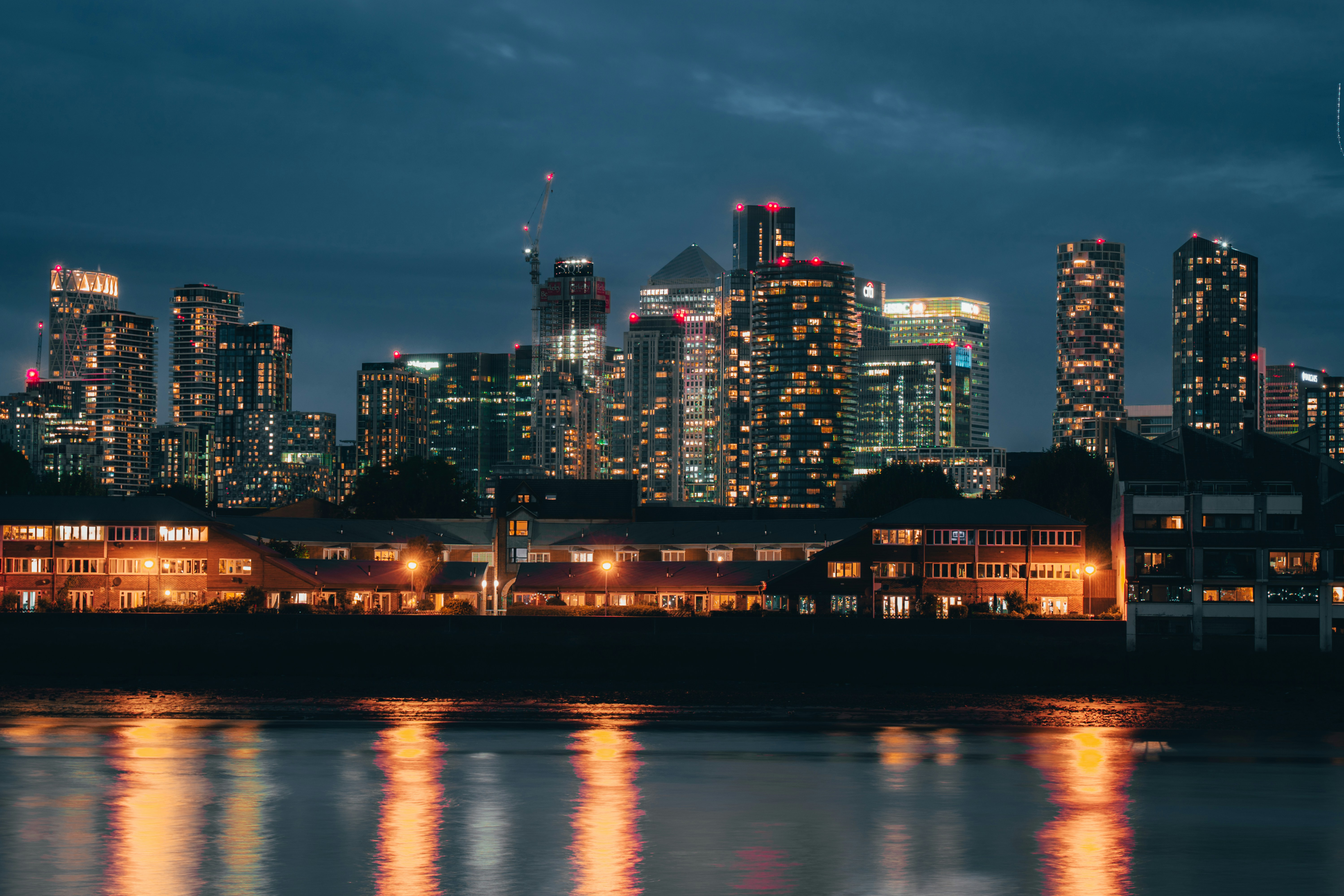 City of gold reflections: harbor lights along the riverfront skyline