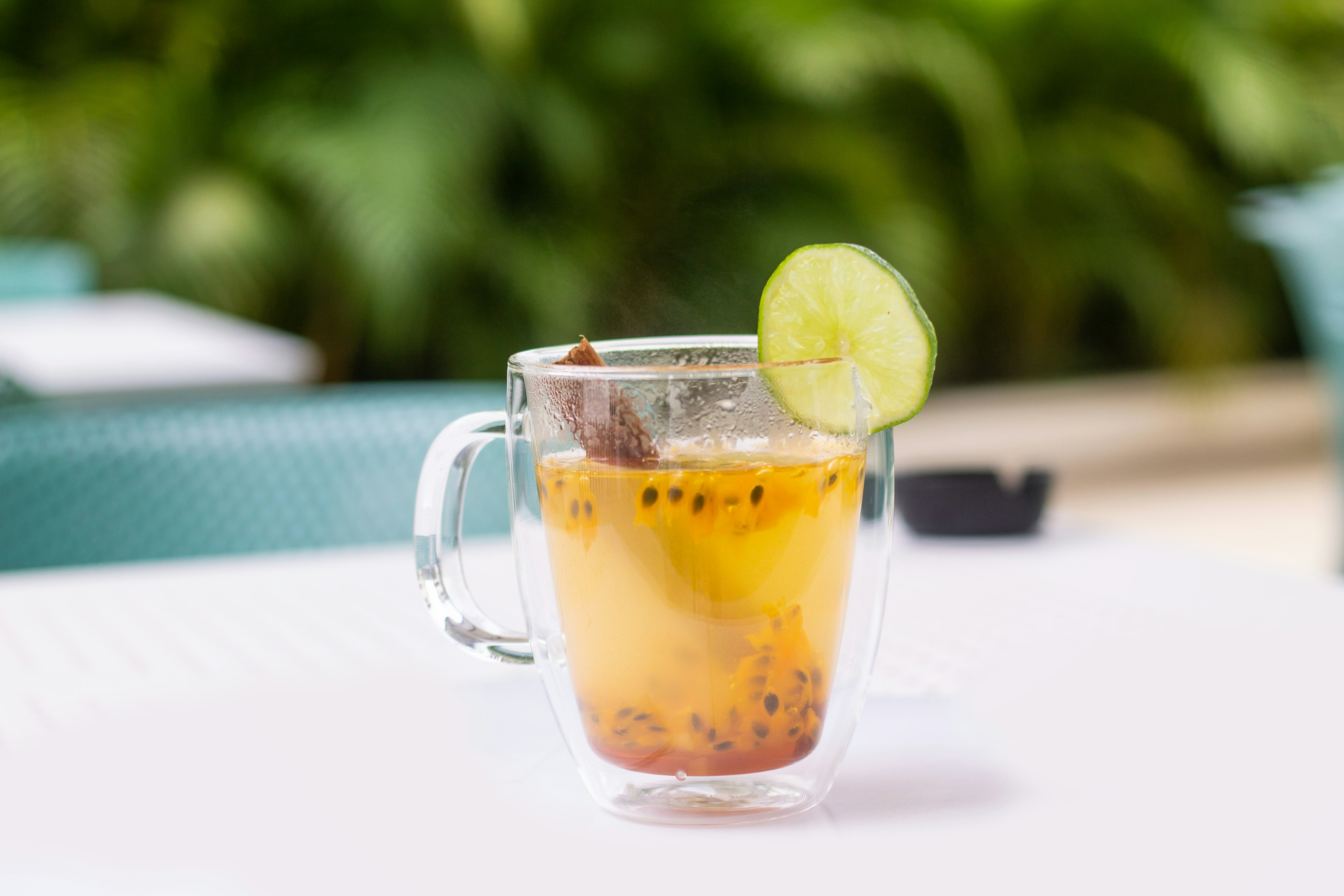 Citrus Glow: A Glass of Sunshine on a White Table