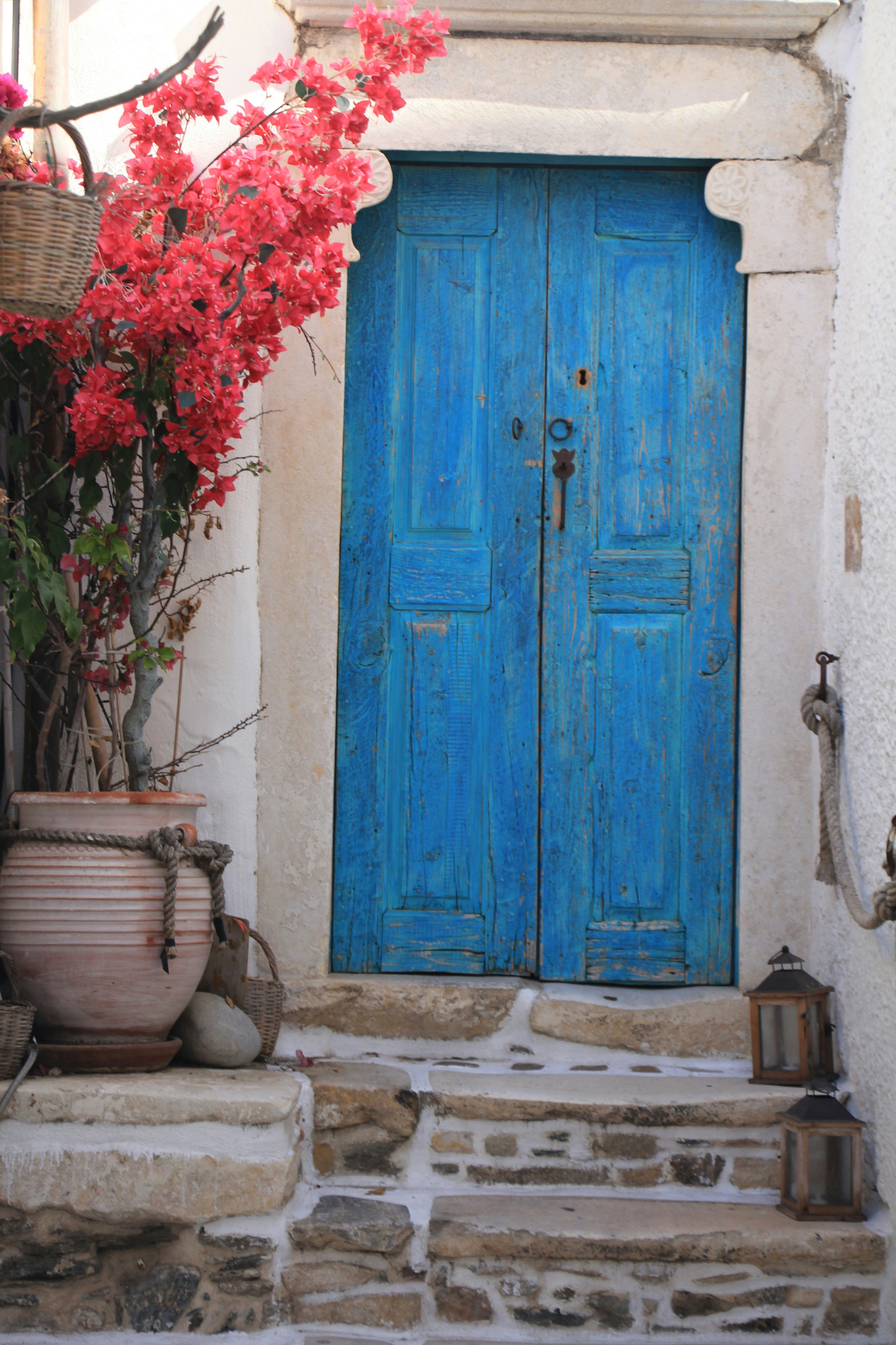 Azure Doorway and Bougainvillea in a Mediterranean Stairwell