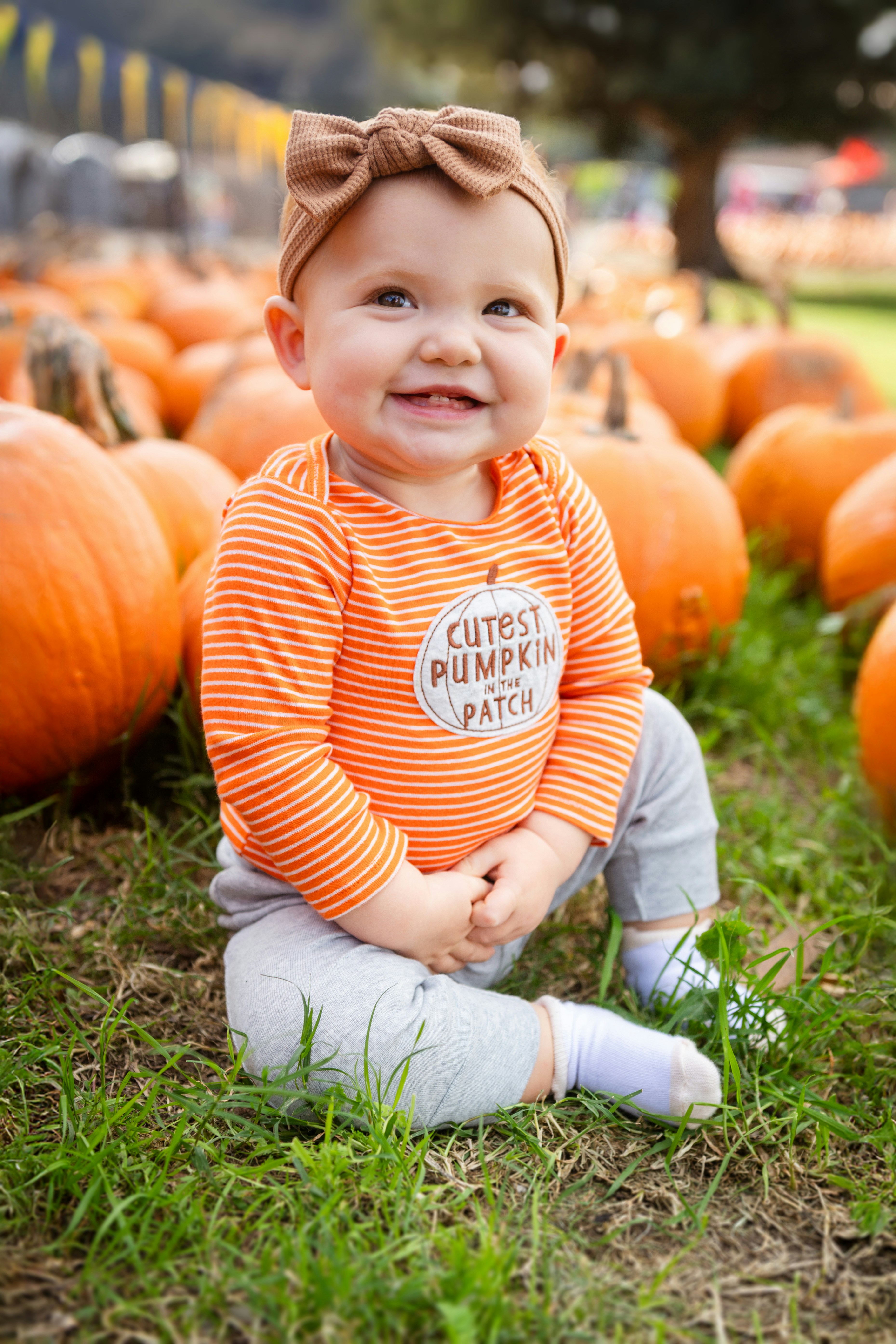 Pumpkin Patch Cheer: A Baby in Orange at the Fall Festival