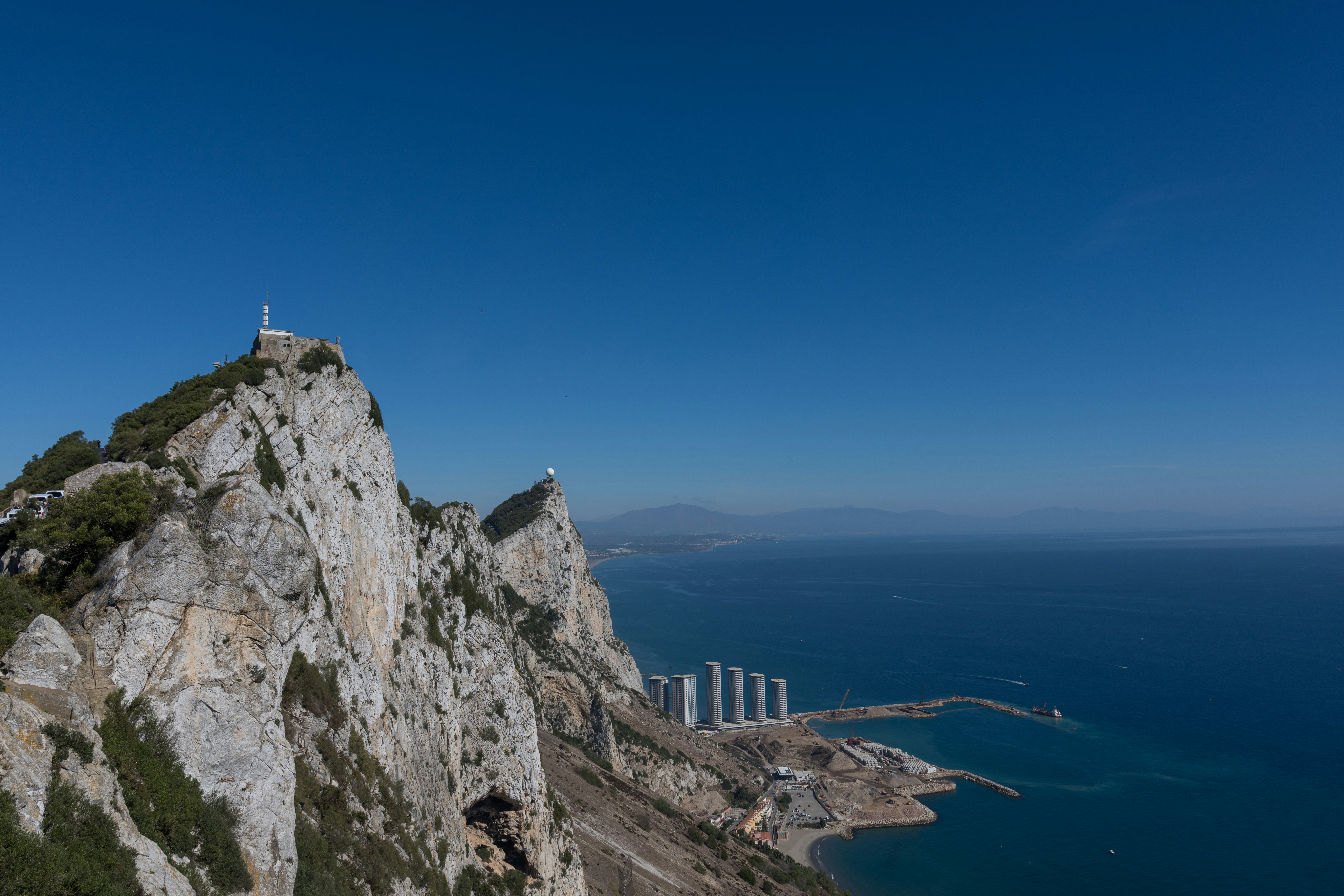 Cliffside Lighthouse Overlooking a Sea-Port