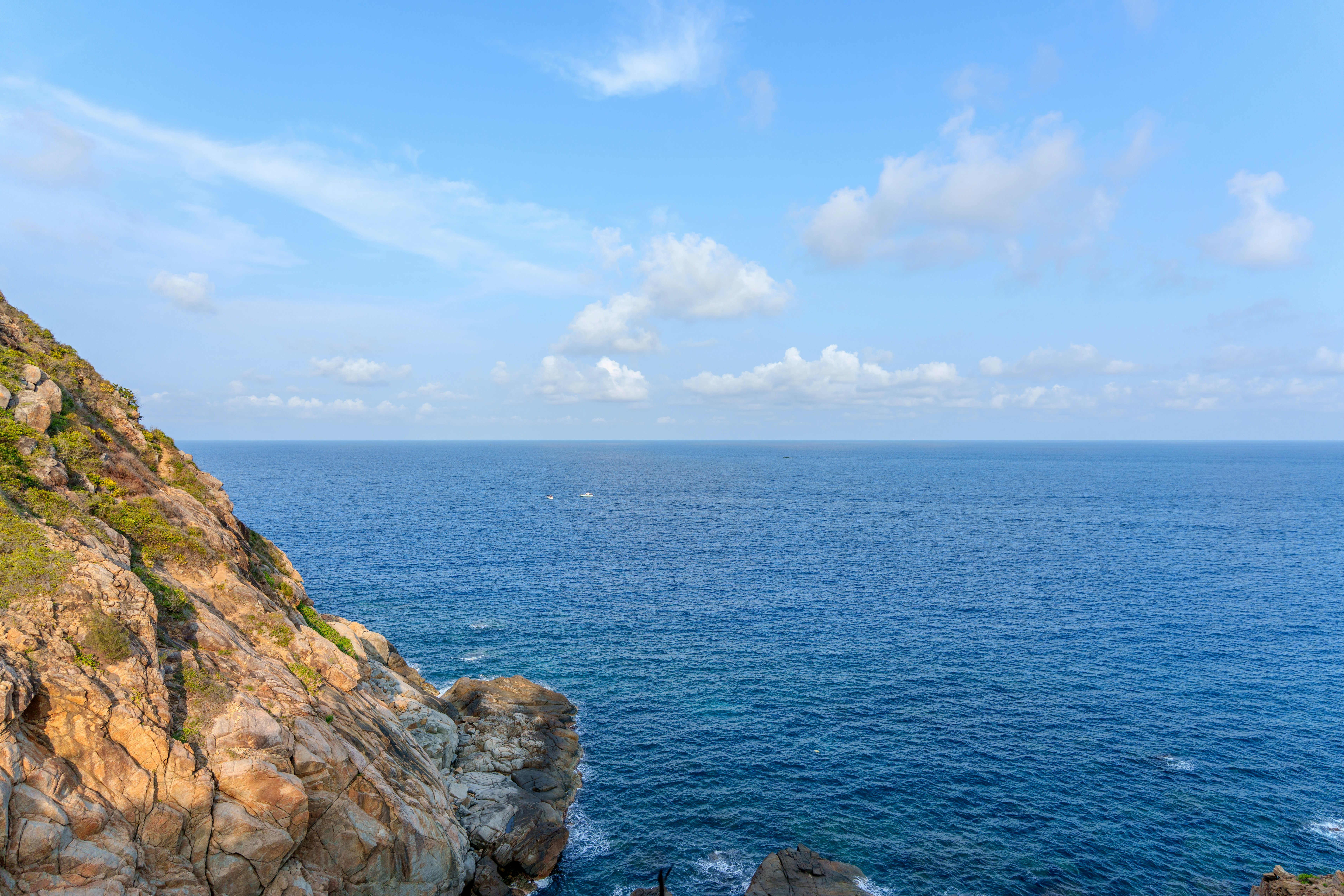 Cliffside Crest Over a Quiet Blue Sea
