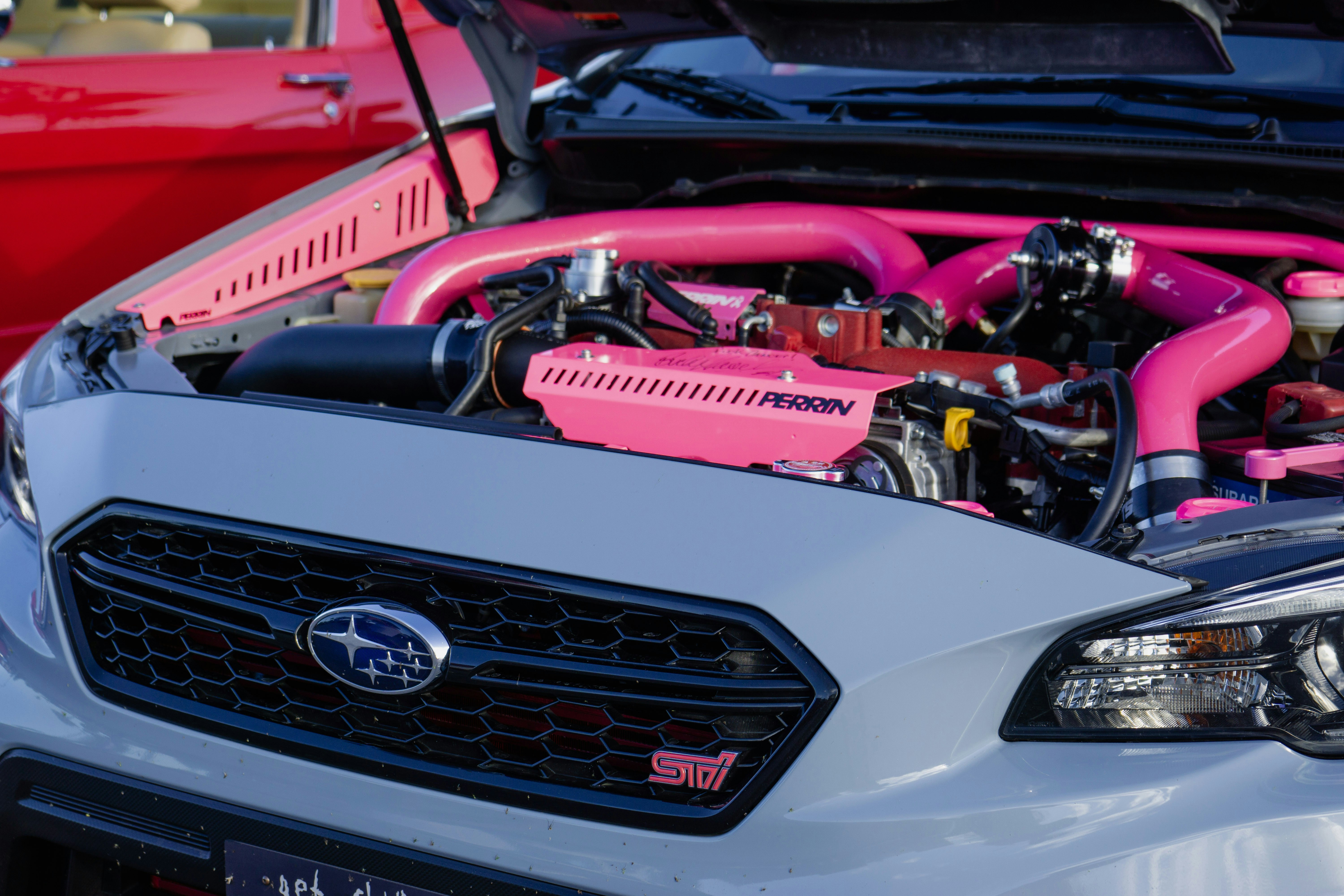 Under the Pink Surge: A Subie Heartbeat in the Engine Bay