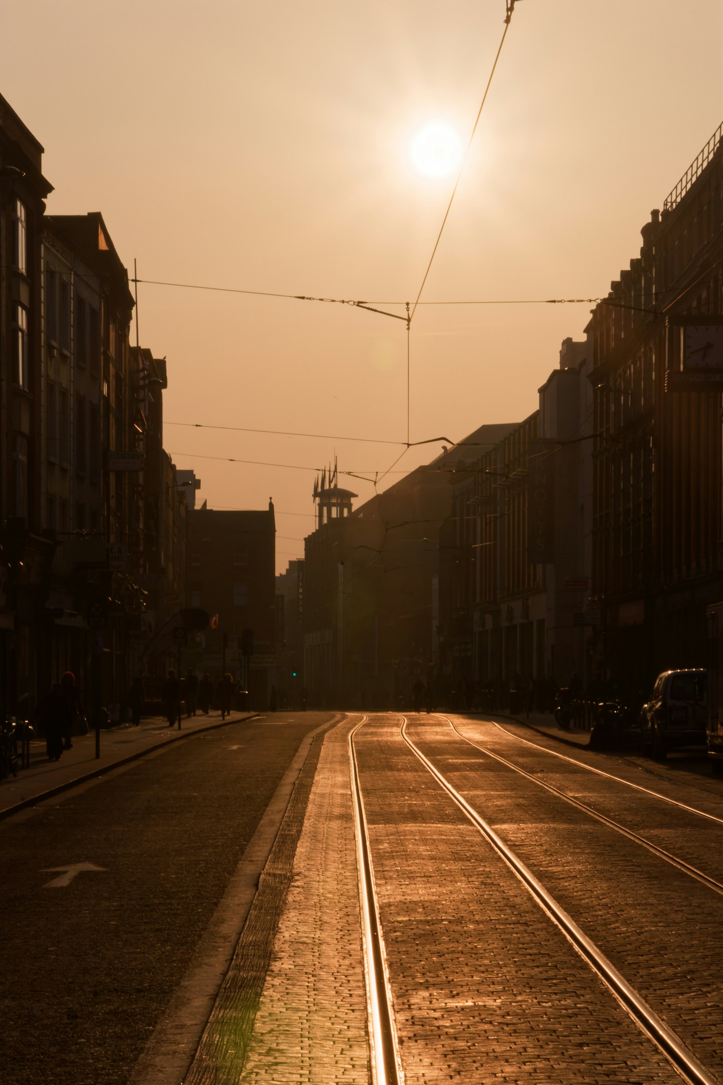 Golden Hour on the Trams: Streetcar Rails Leading Into the Sunset