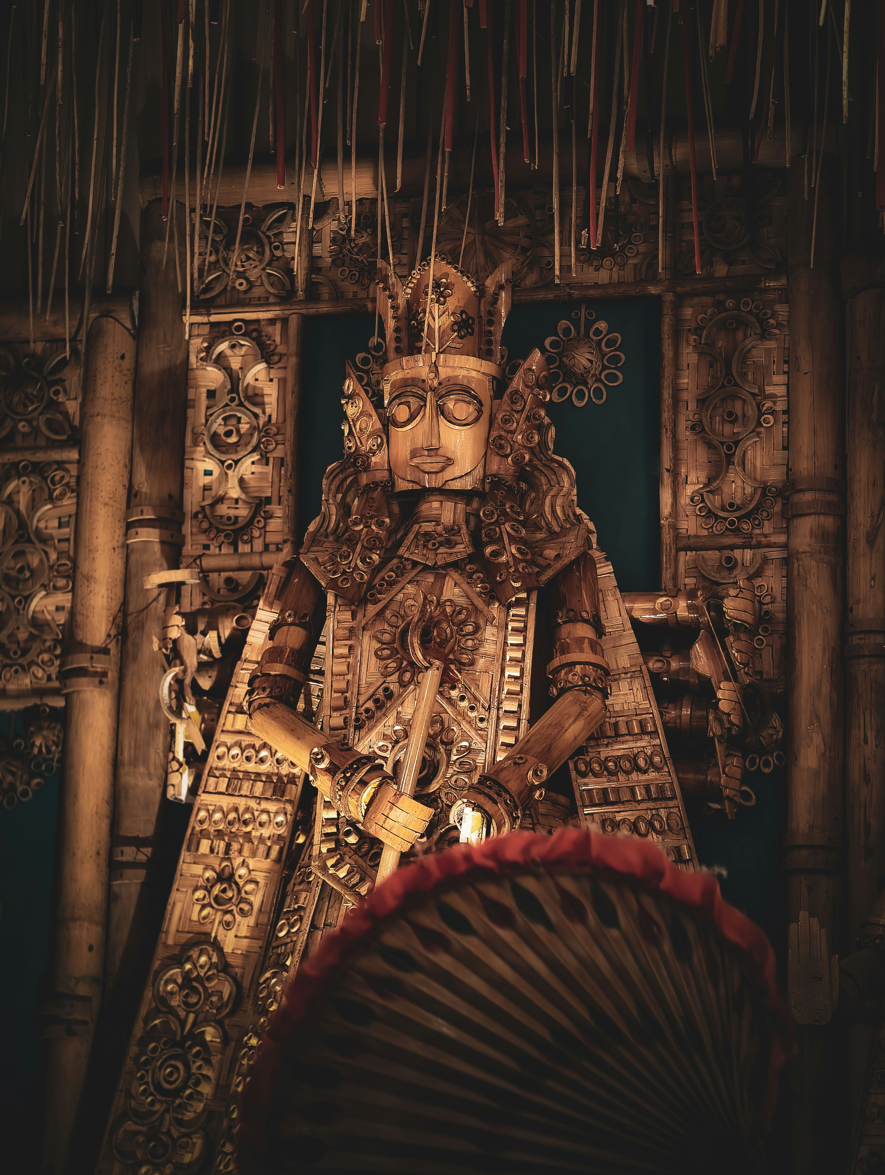 The Regal Carved Guardian Beneath Hanging Vines