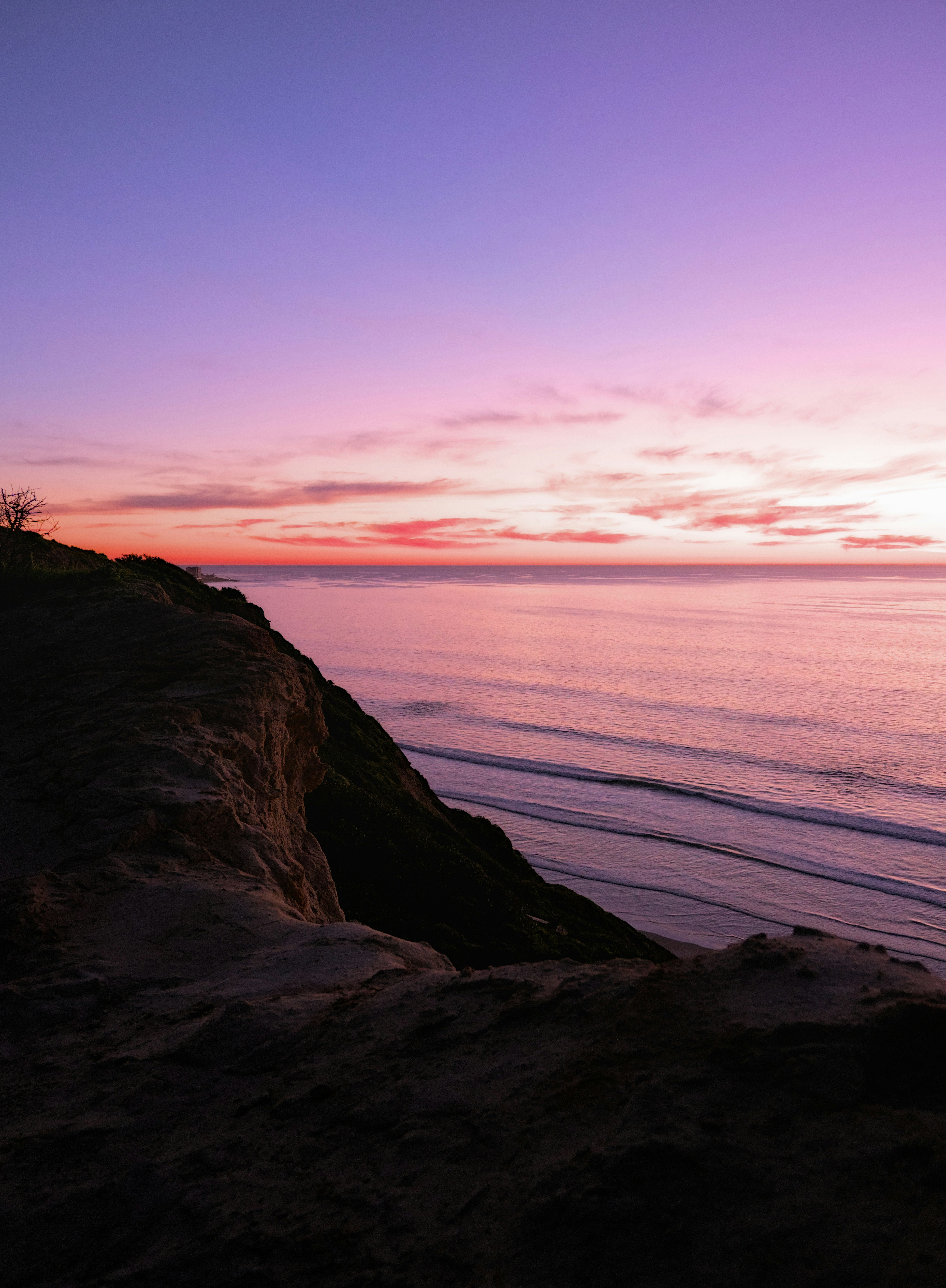 Sunset Cliff Edge over a Calm Sea