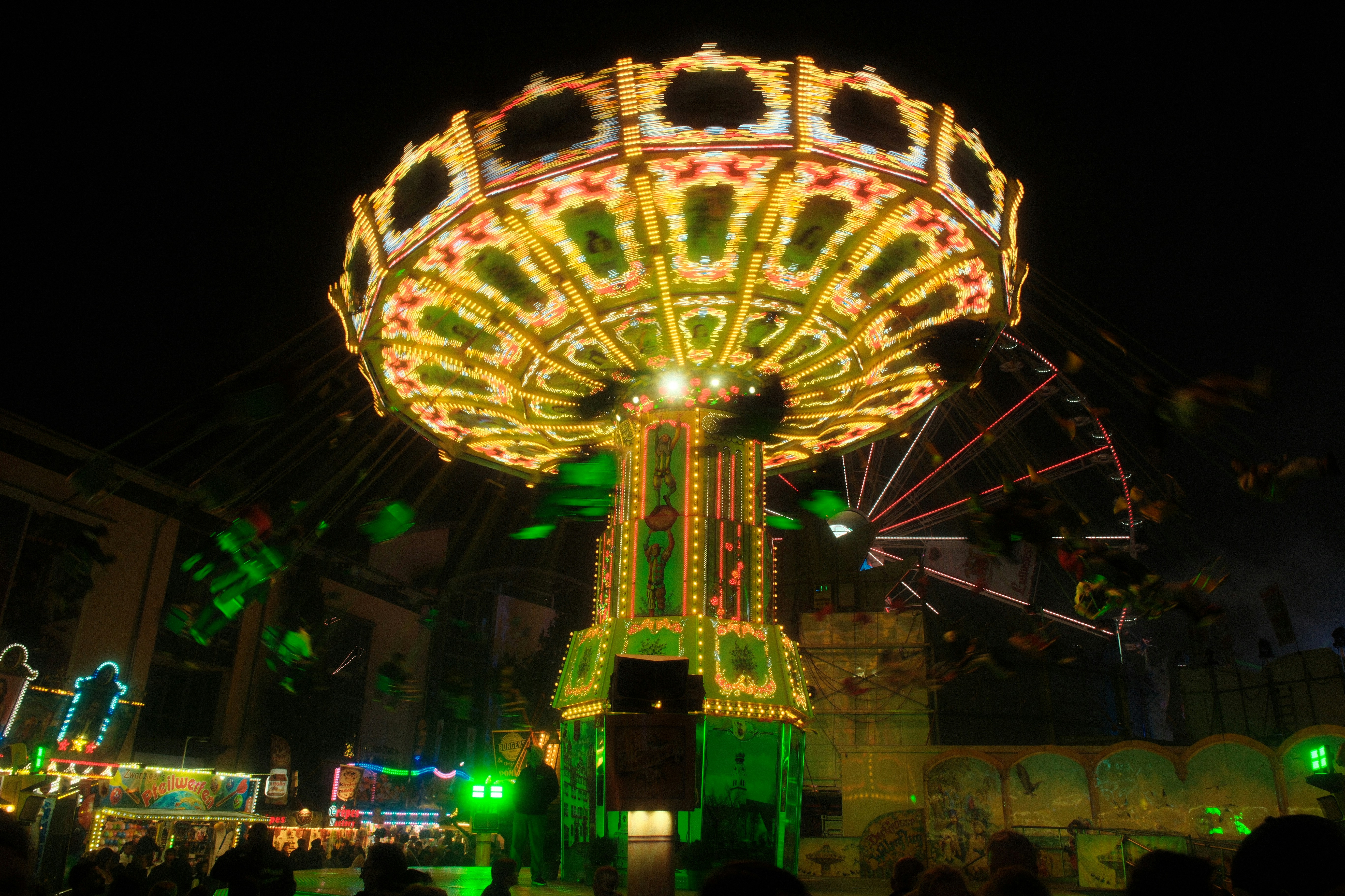 Night Carousel Bloom: Neon Motion beneath a Velvet Sky