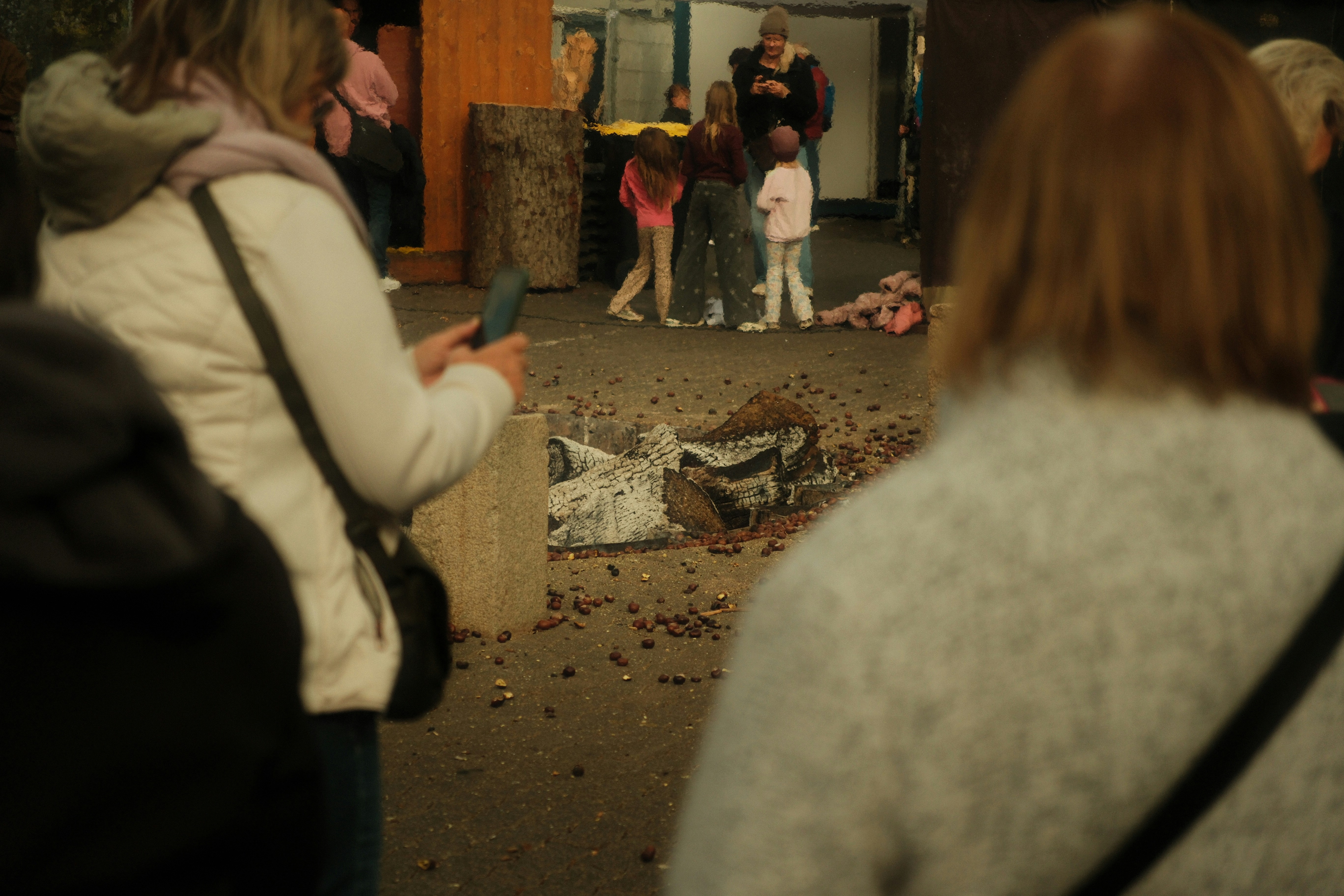 Quiet Gathering Around a Centered Ember: Faces and Fragments in a Memorial Space