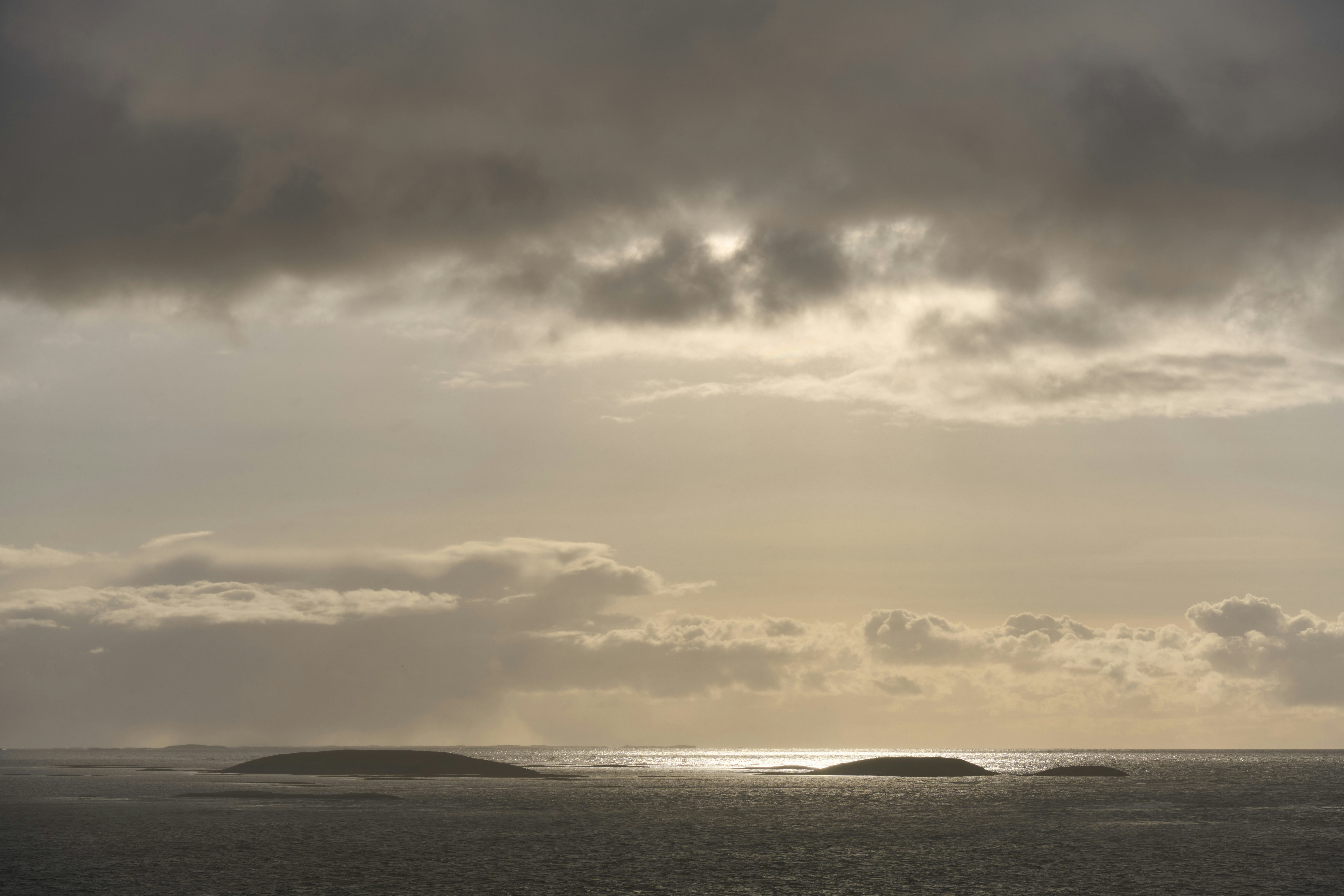Distant Isles Under Quiet Sky at Dusk