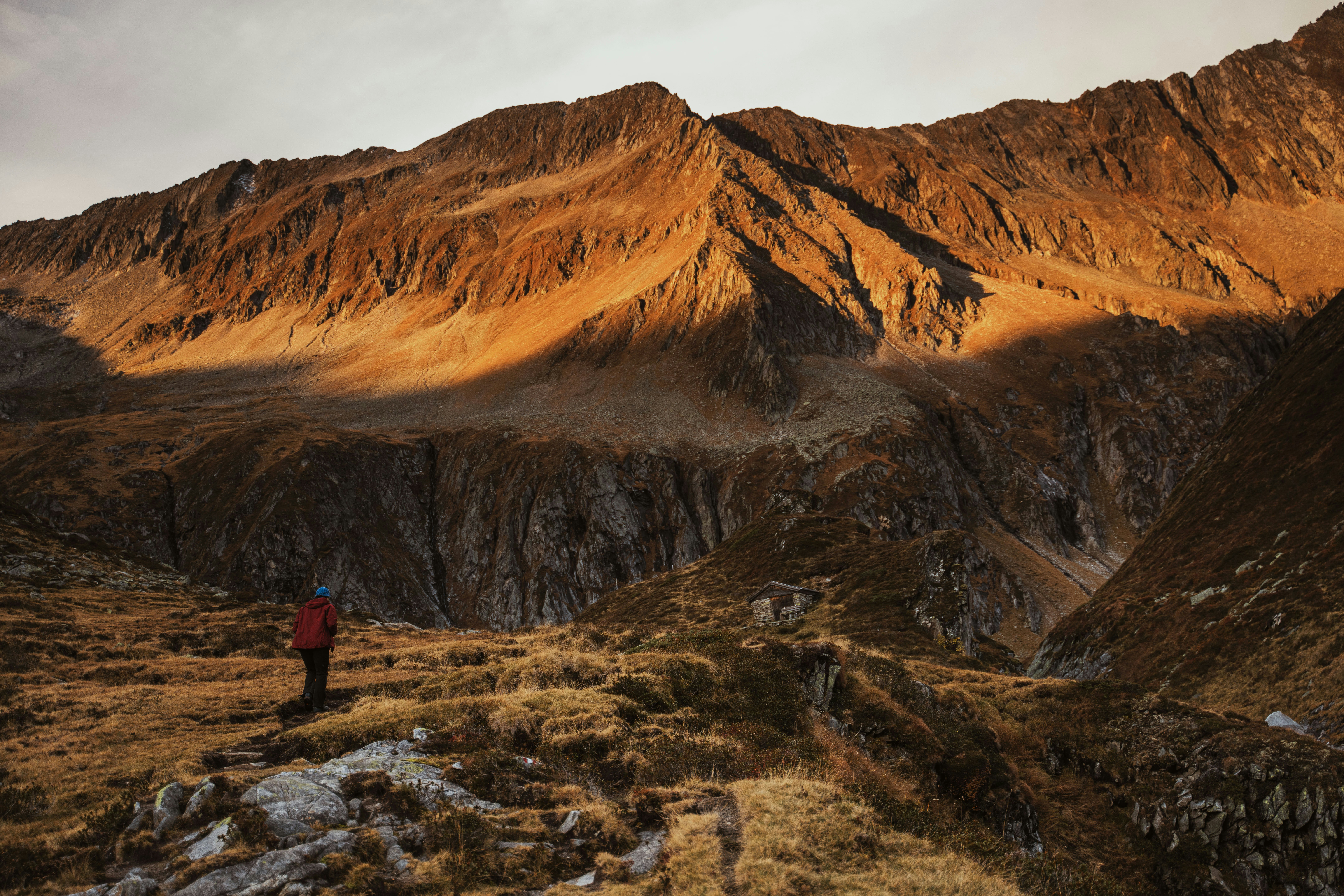 Echoes on the Ridge: a solitary climber under a golden amphitheatre
