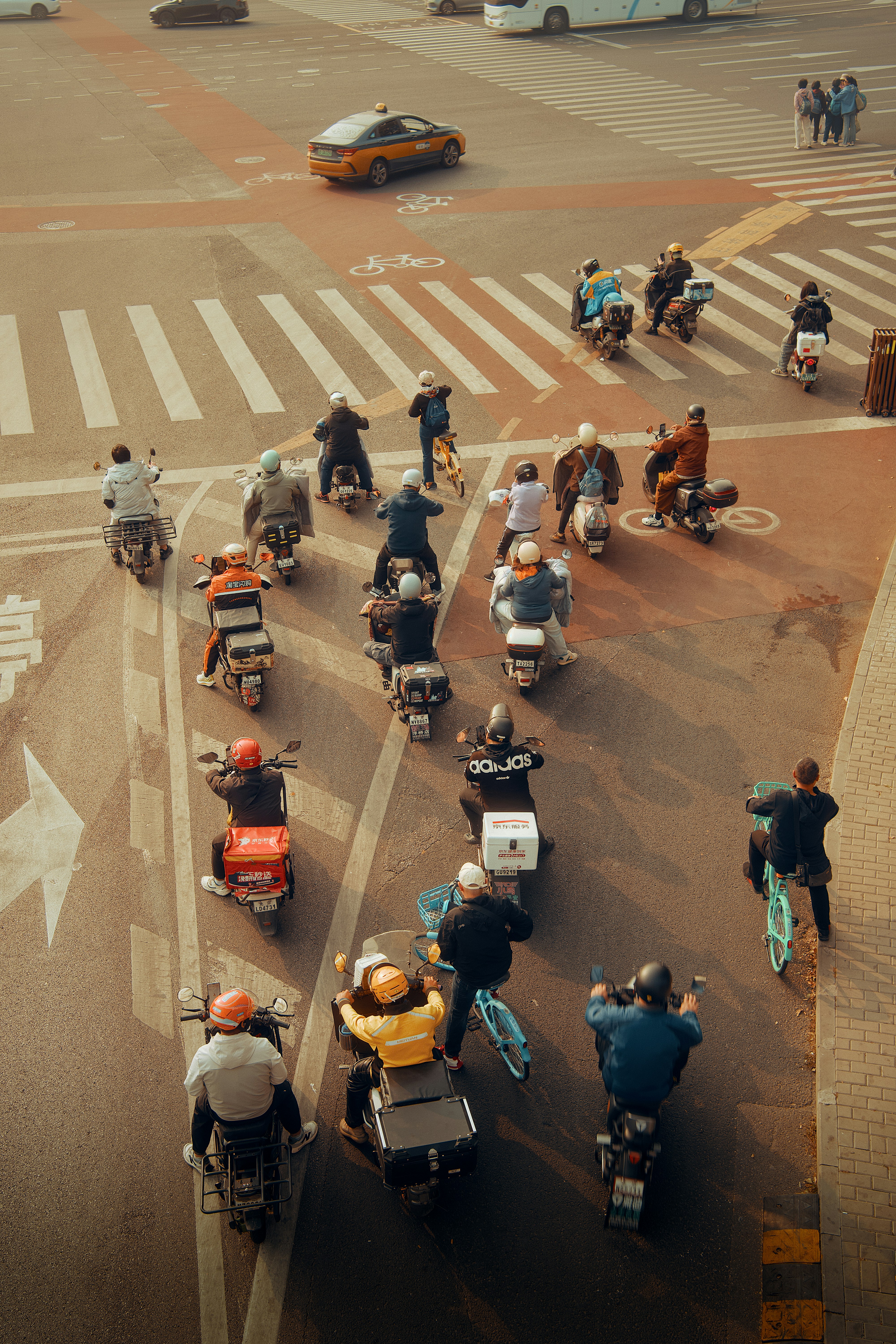 Rush Hour Ballet: A Field of Scooters at a Busy Intersection