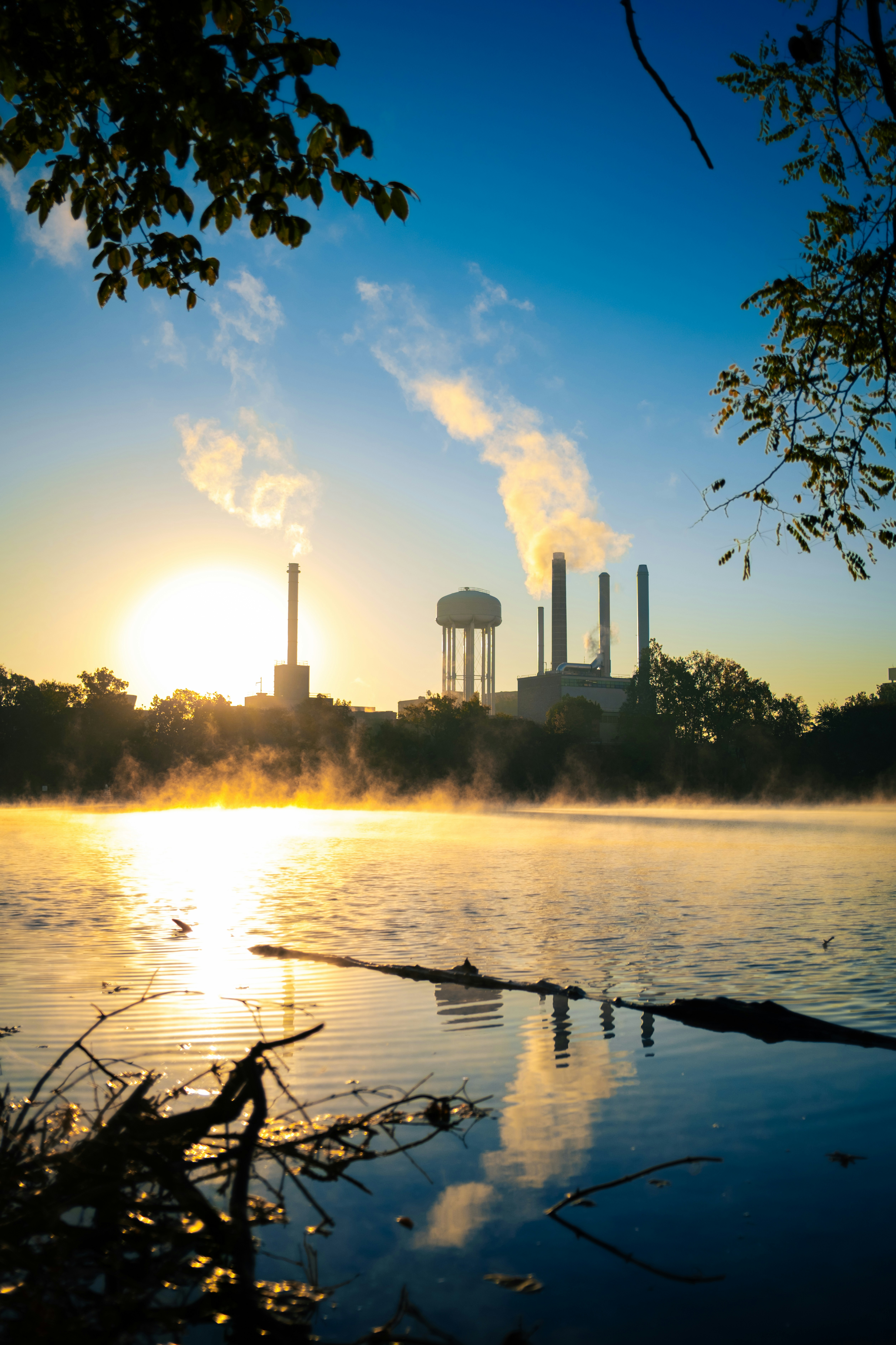 Sunrise over the Industrial Horizon: Steam, Silence, and Reflections