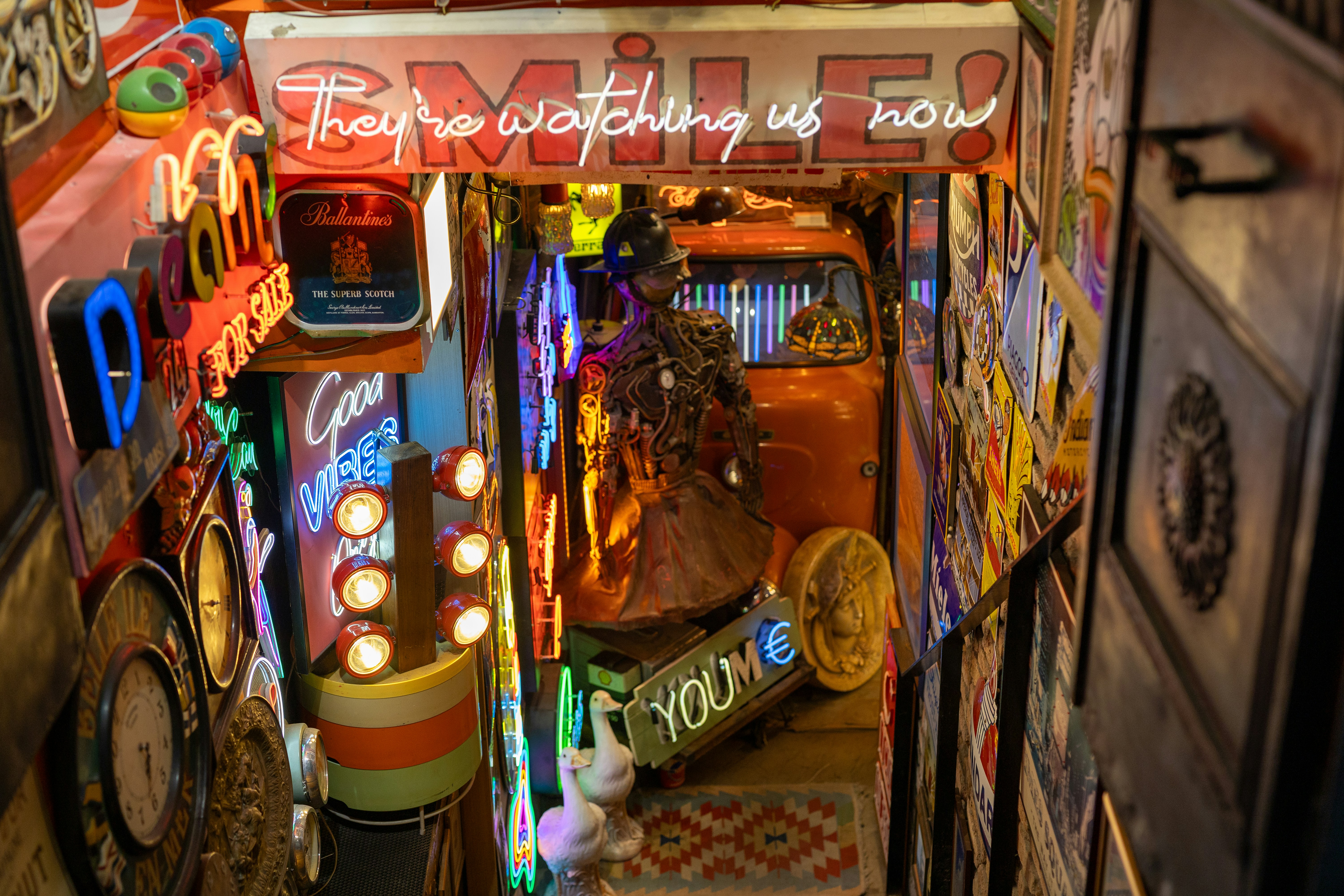 Neon Shrine in a Narrow Carnival Corridor