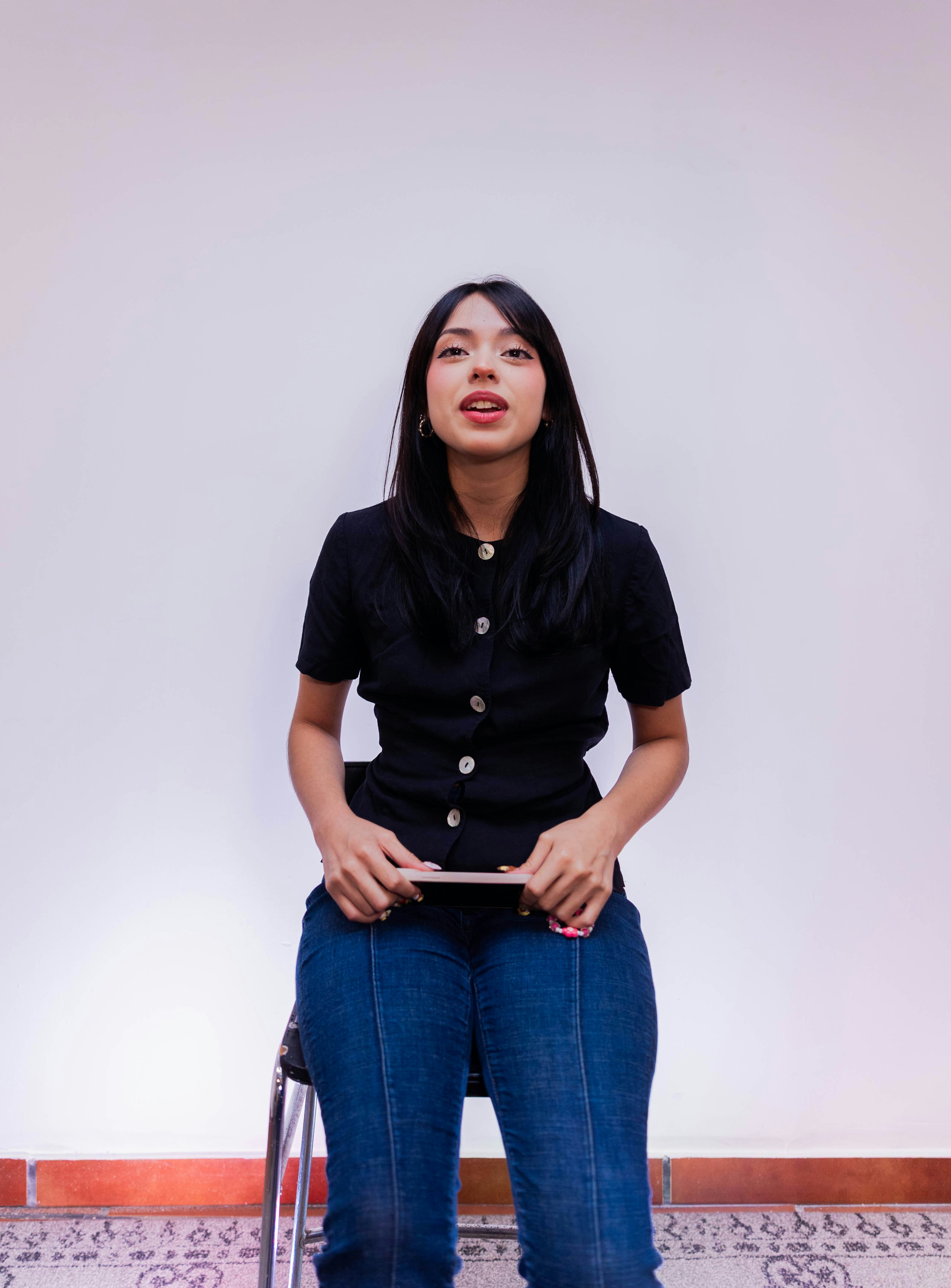 Studio Portrait: A Confident Smile in a Minimal White Backdrop