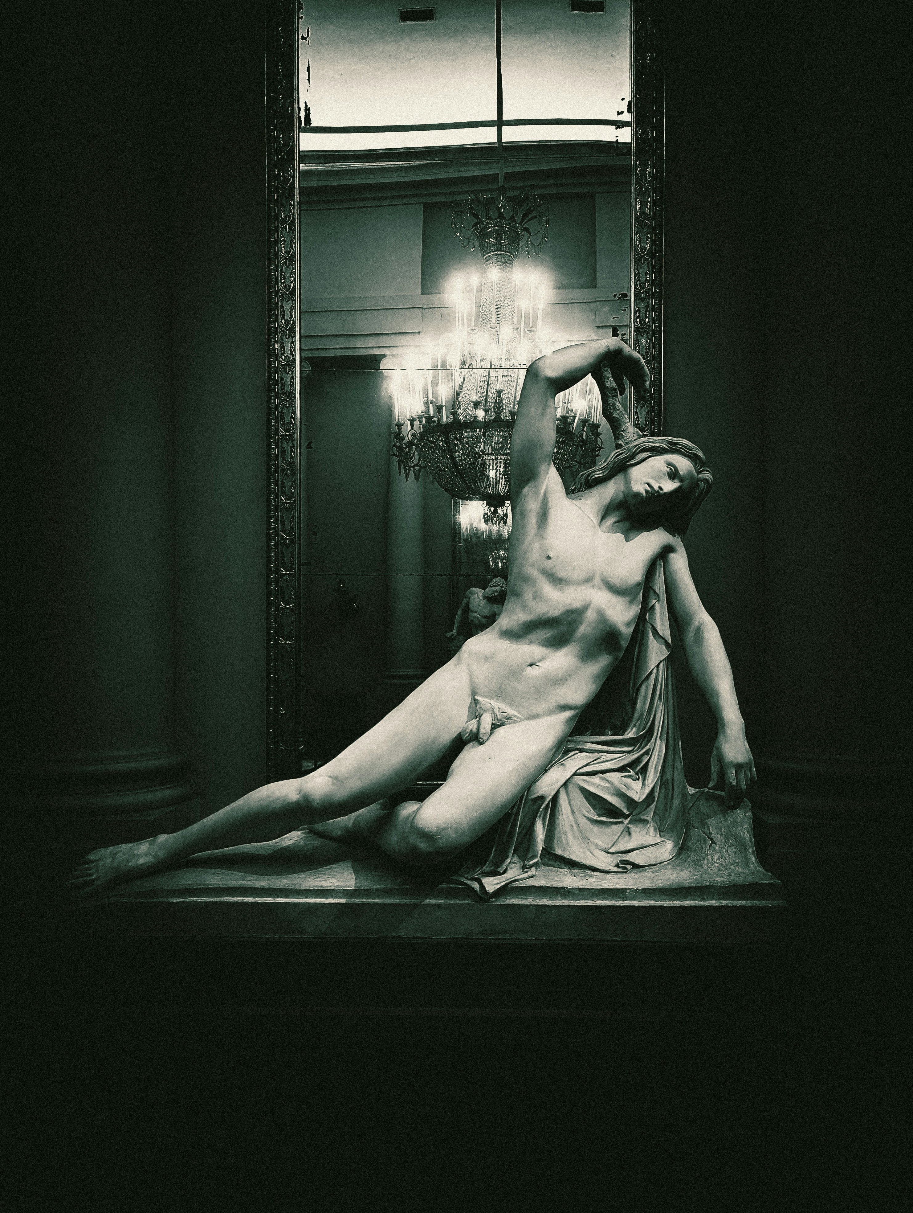 Sculpted Poise: A Classical Muse Framed by Crystal Light