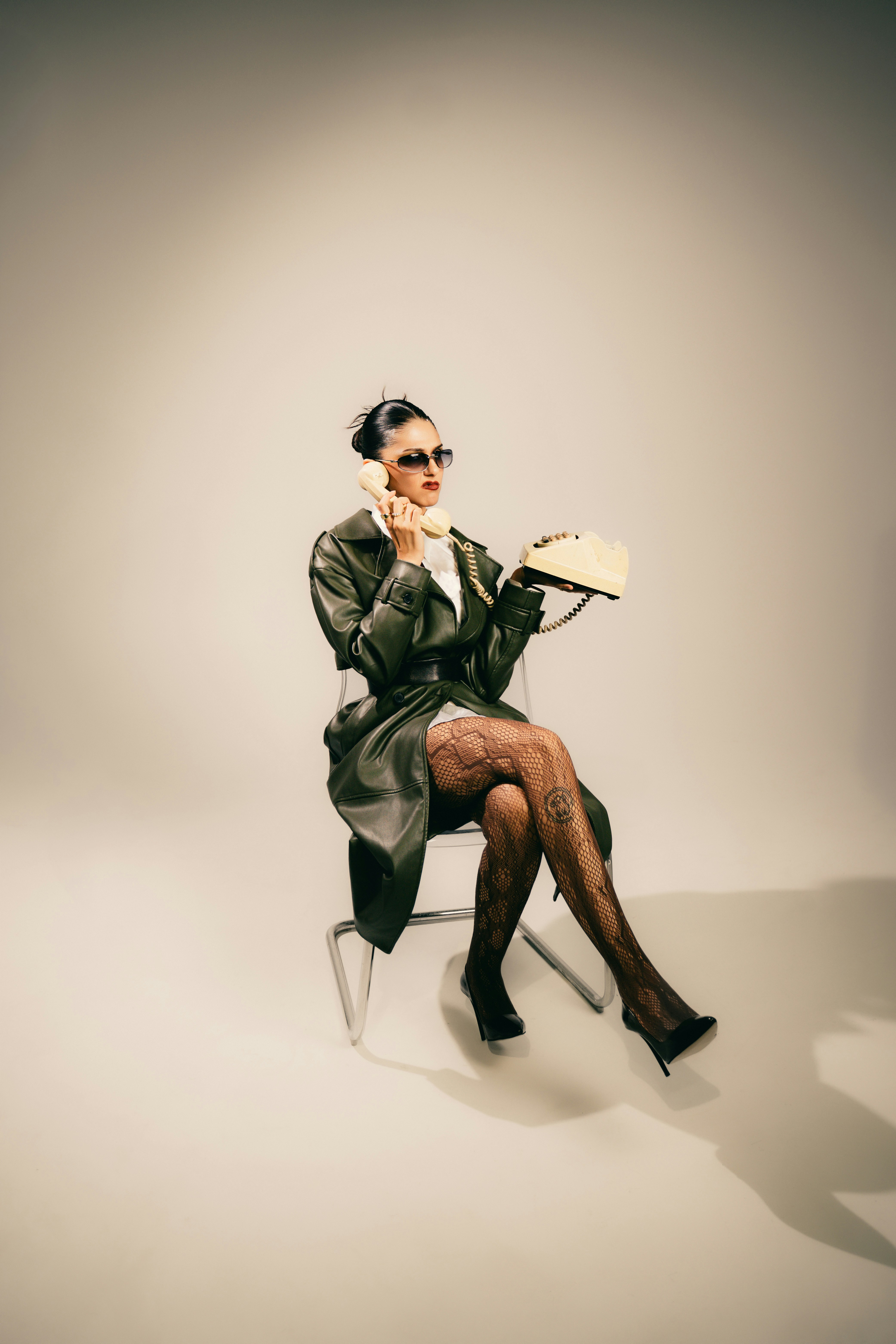 Midnight Telephone: A Confident Figure in Leather and Lace