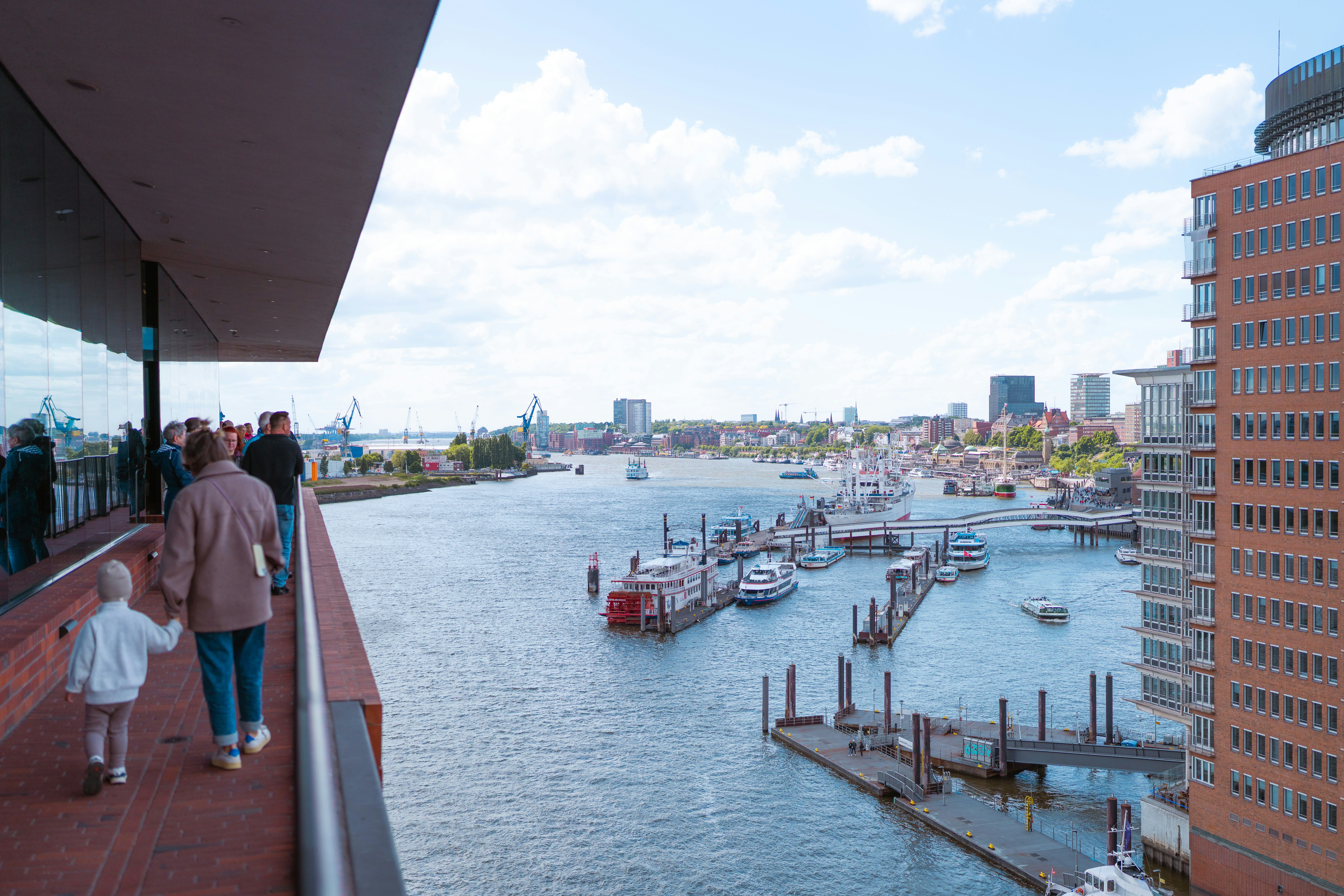 Balcony Walk Toward the Waterfront Cityscape