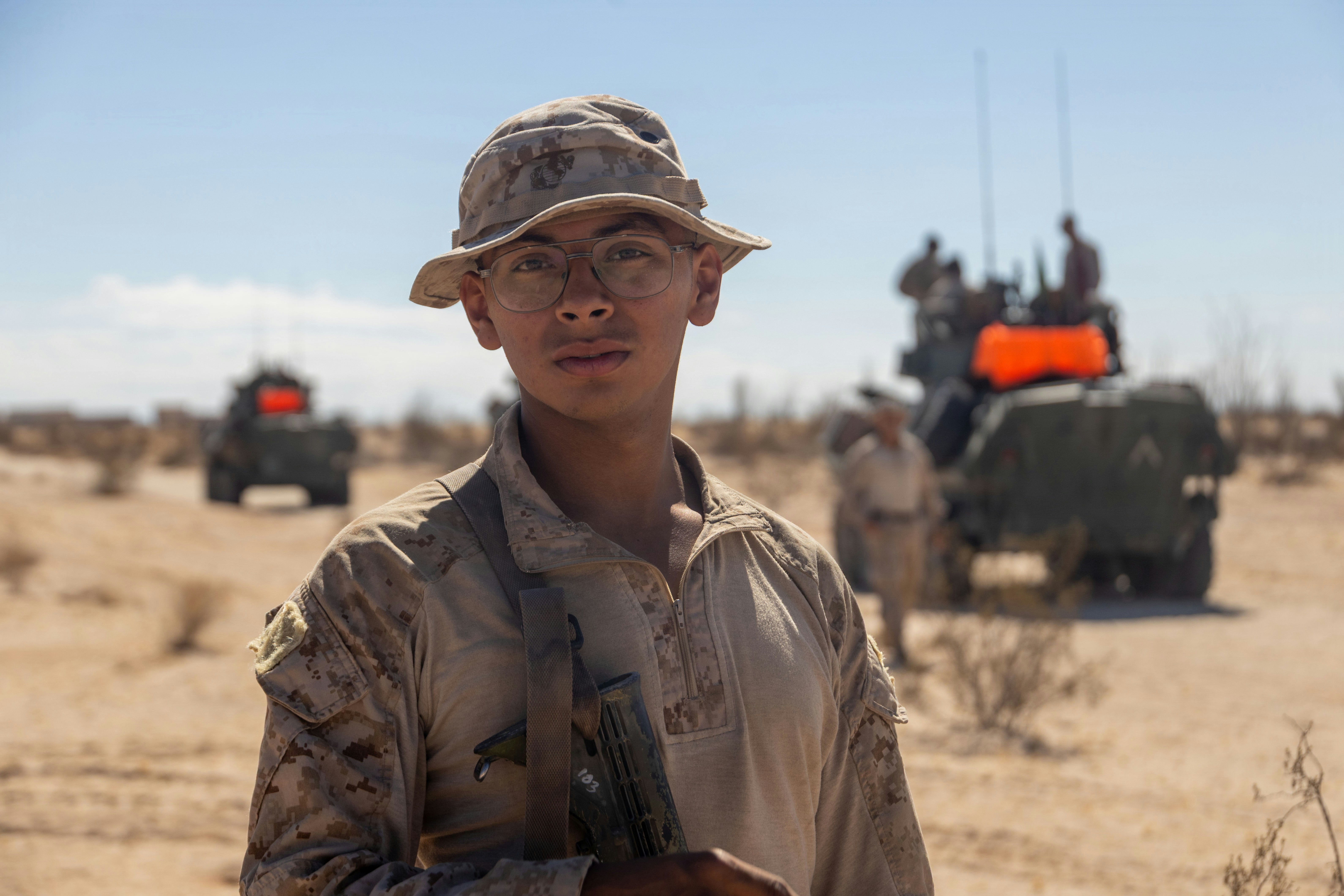 U.S. Navy Hospitalman Amin HernandezGarcia, with Charlie Company, 3d Light Armored Reconnaissance Battalion, 1st Marine Division, poses for a photo during a close air support exercise during Weapons and Tactics Instructor course 1-27 at Yuma, Arizona, Oct. 19, 2026. WTI is a seven-week training event hosted by Marine Aviation Weapons and Tactics Squadron One which emphasizes operational integration of the seven functions of Marine aviation in support of the Marine Air Ground Task Force, Joint and Coalition Forces. HernandezGarcia is a native of California. (U.S. Marine Corps Photo by Sgt. Calah Thompson)