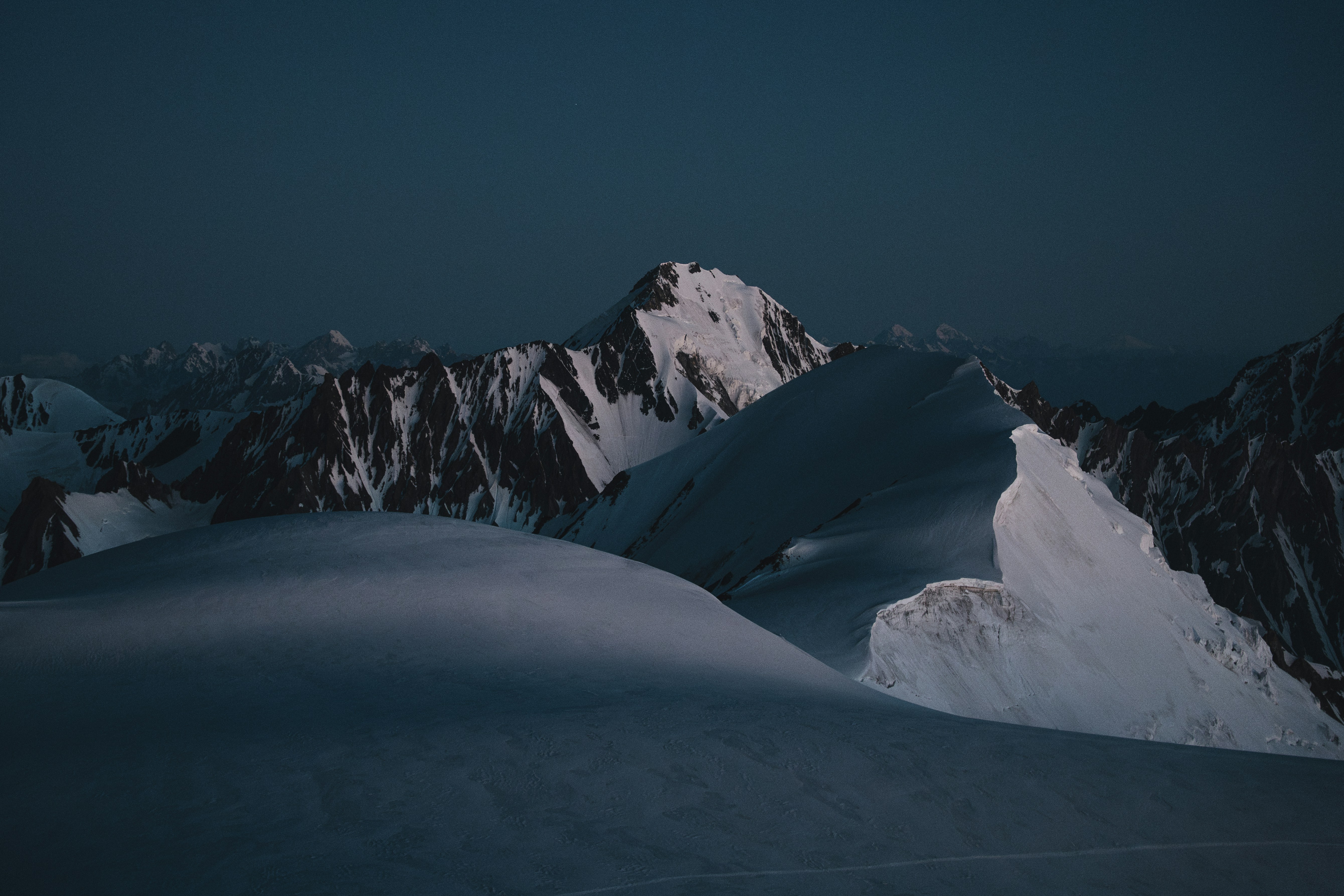 Midnight Ridge: A Snowbound Summit Under a Quiet Sky